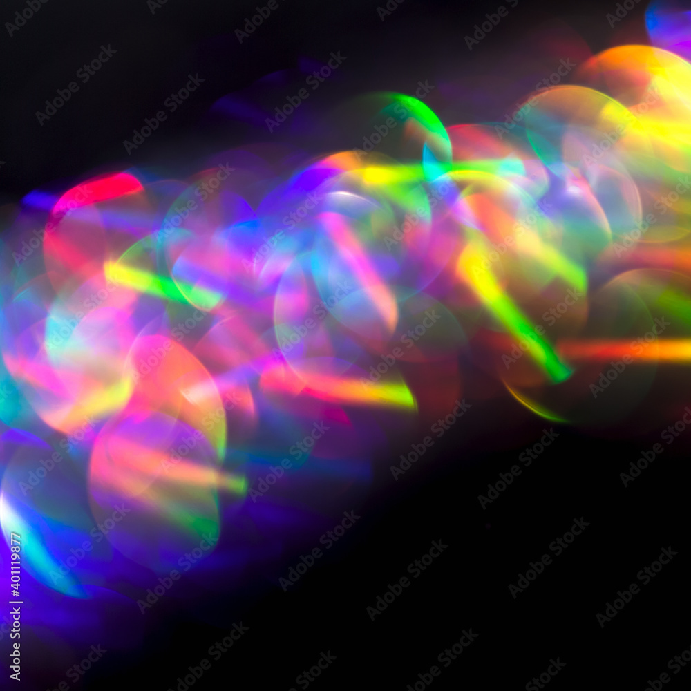 Defocused lights. Multicolor neon lights flares and trails lines in ...