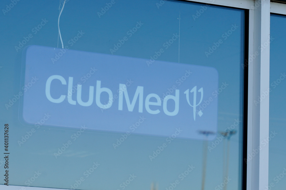 Club Med sign text and logo brand front of office Club Mediterranee ...