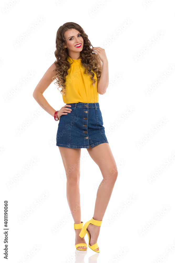Fashion Model In Jeans Mini Skirt And High Heels Is Posing With Hand On ...
