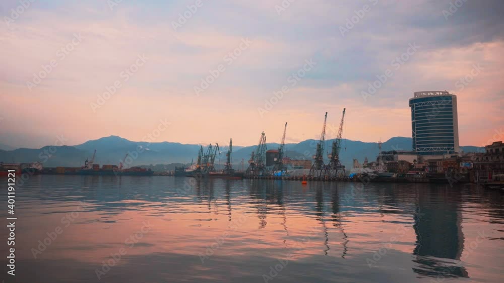 Stunning view of the sea port of Batumi with cranes, barges and ships ...
