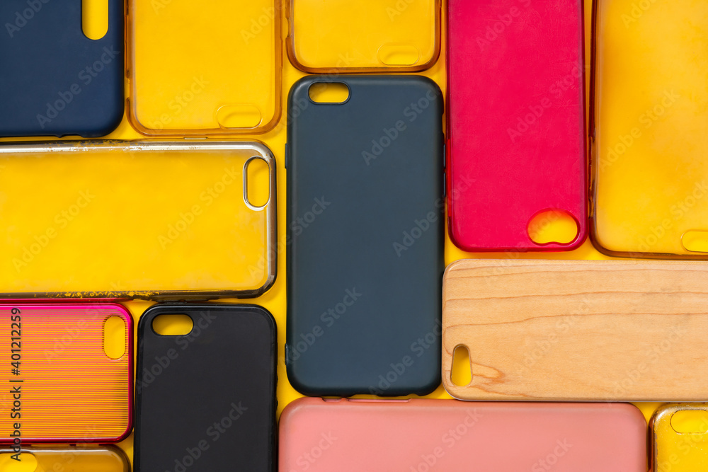 Pile of multicolored plastic back covers for mobile phone. Choice of ...