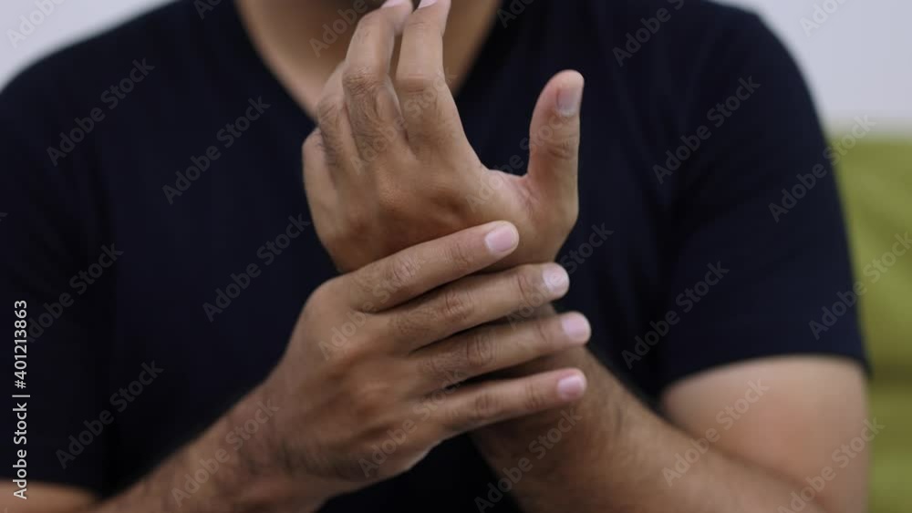 Close up male hand get hurt and pain in hand, wrist. Symptom office ...