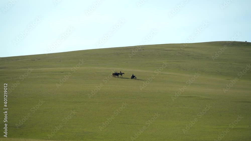Horsemen and motorcycle in the treeless Central Asian steppes.Grassland ...