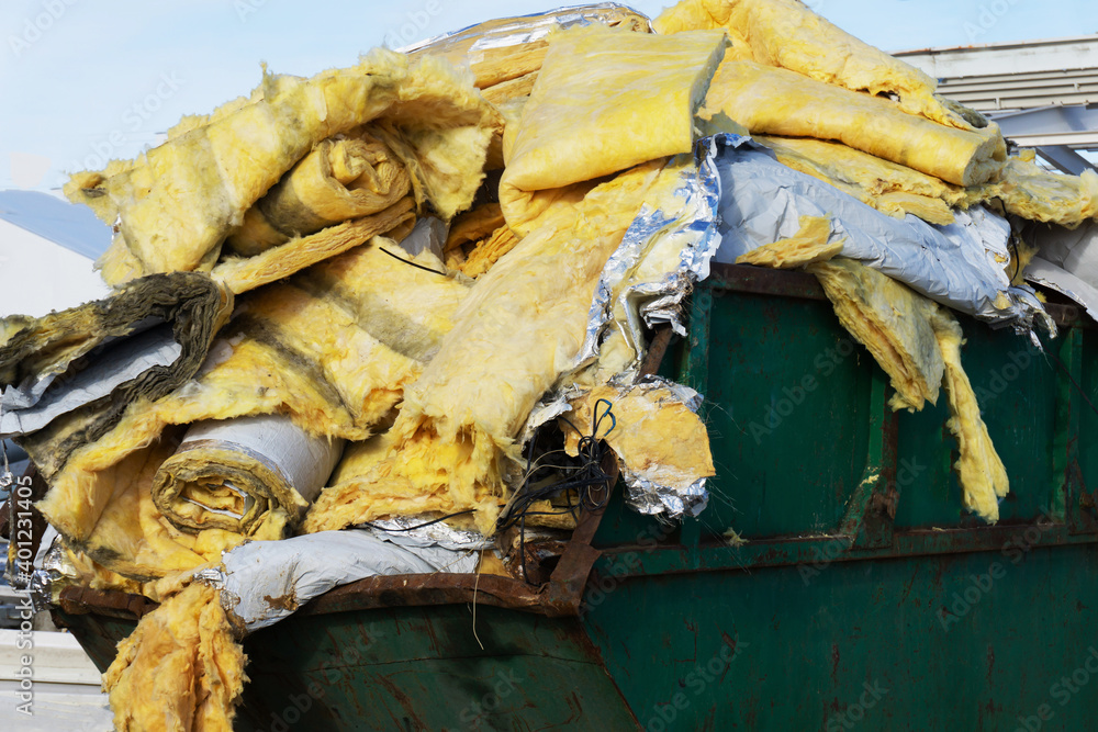 Construction waste in a metal container. Disposal of hazardous ...