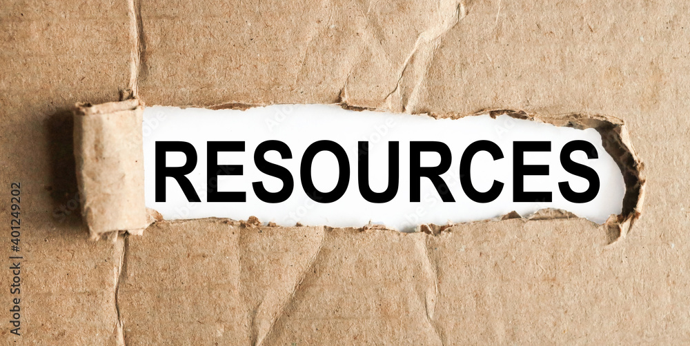 resources, text on white paper on torn paper background Stock Photo ...