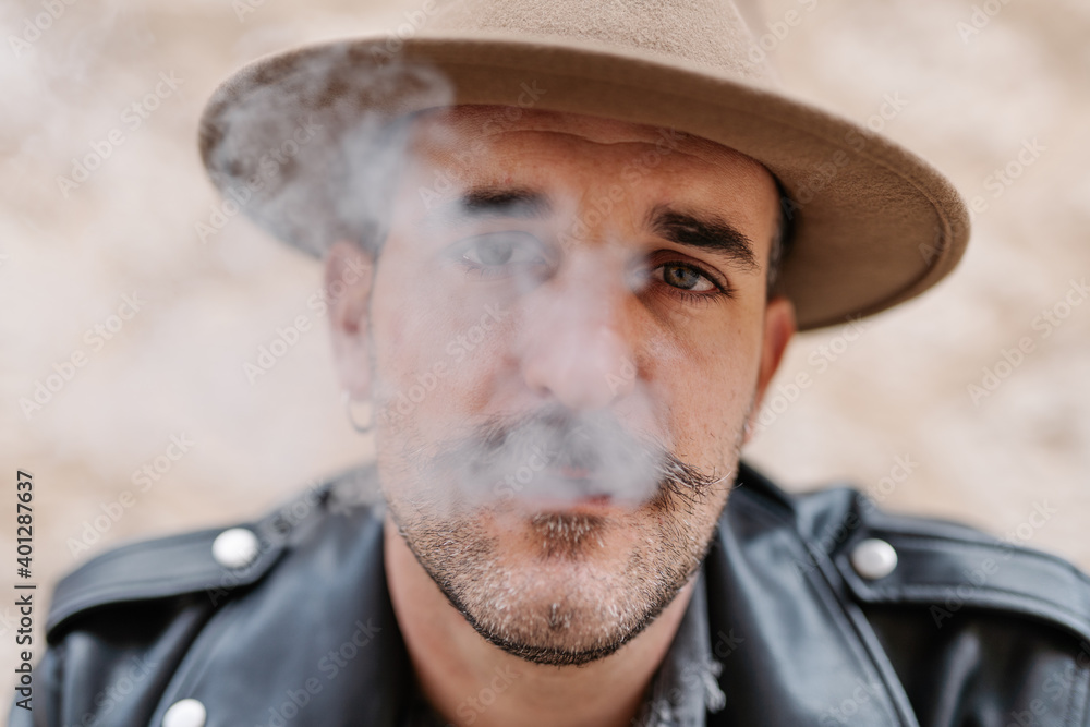 Cool handsome guy in with gorgeous mustache smoking cigarettes and ...