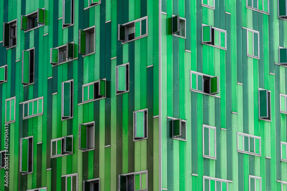 Corner of part of contemporary building with vivid green facade and ...