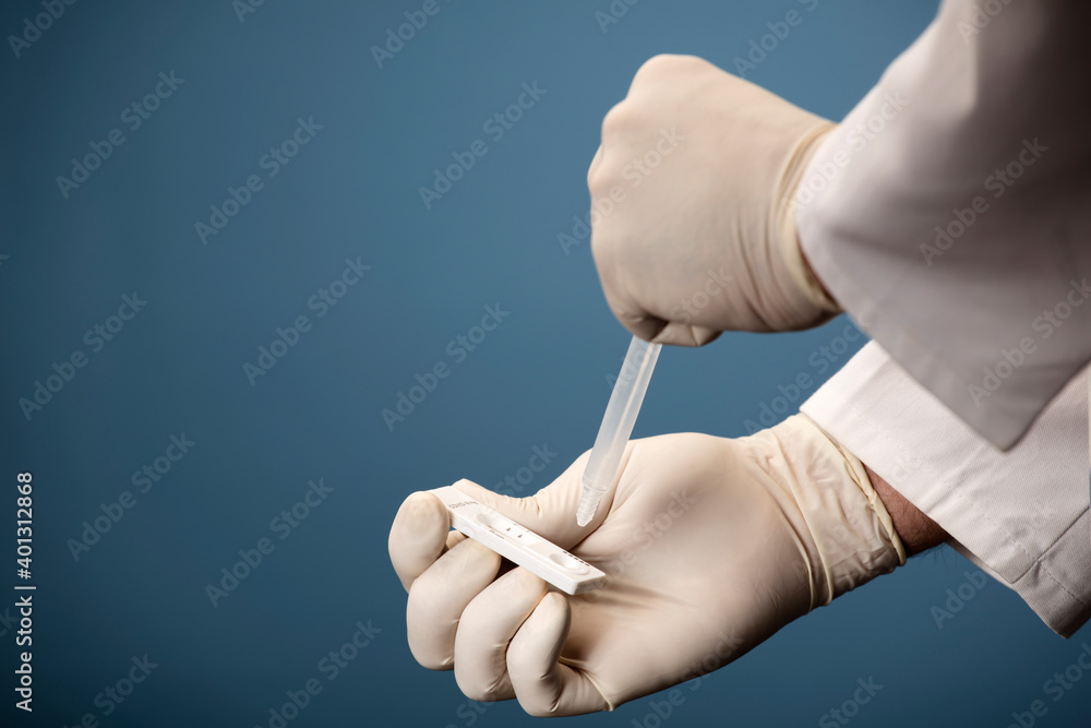 Doctor containing a COVID-19 2019-nCoV viral disease test kit. SARS-CoV ...