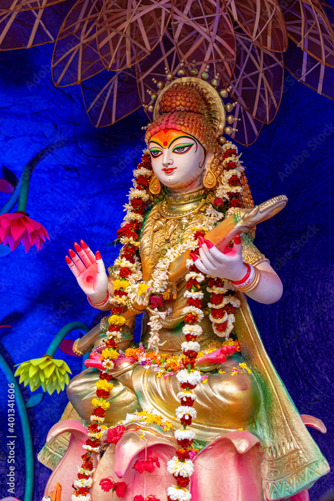 Idol of Goddess Devi Saraswati at a decorated puja pandal in Kolkata ...
