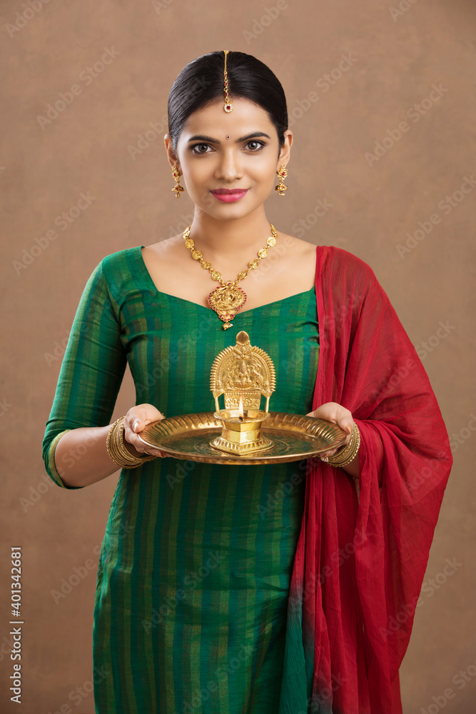 Hindu Indian young women holding Deepam in hands. ( Kamatchi vilakku ...