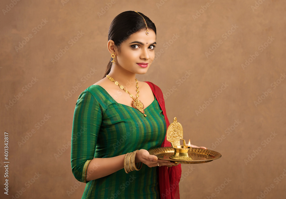 Hindu Indian young women holding Deepam in hands. ( Kamatchi vilakku ...
