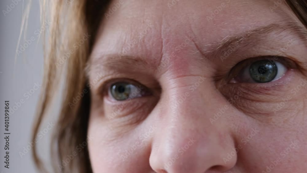 gray eye with spots on iris, wrinkles on eyelids close up, human vision ...