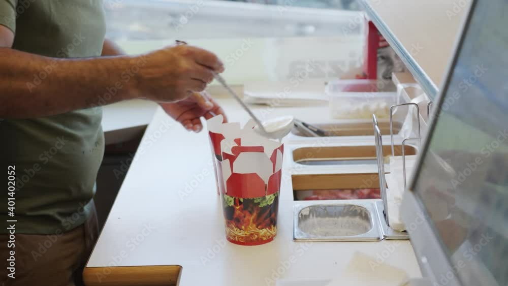 Chef preparing döner kebap box for customer. Traditional Turkish and ...
