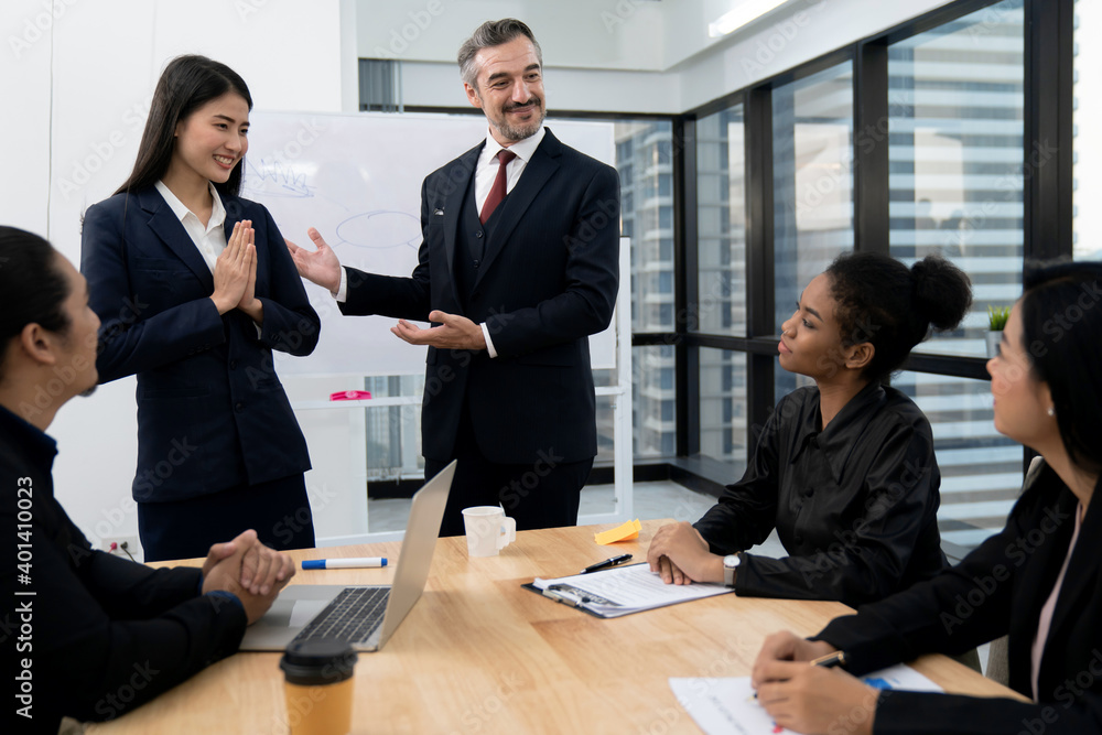 Business executives congratulate employees on their excellent work ...