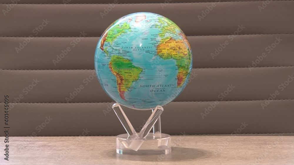 Planet Earth from space. Realistic world globe slowly revolves around ...