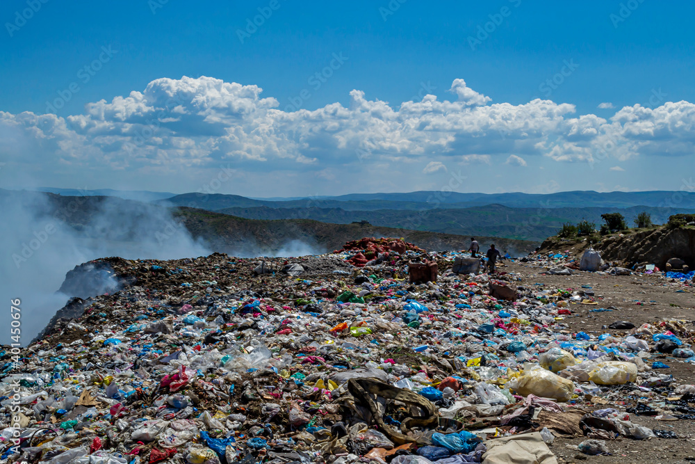 View of garbage field in trash dump or open landfill, food and plastic ...