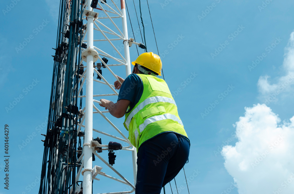 Engineer or Technician wear safety equipment climb high telecom tower ...