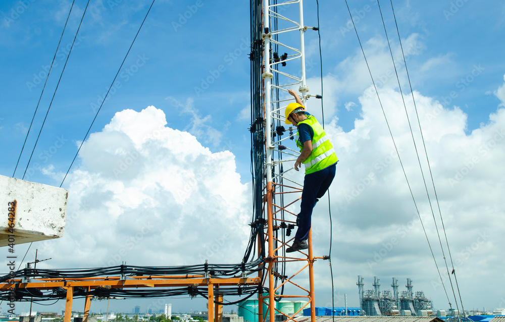 Engineer or Technician wear safety equipment climb high telecom tower ...