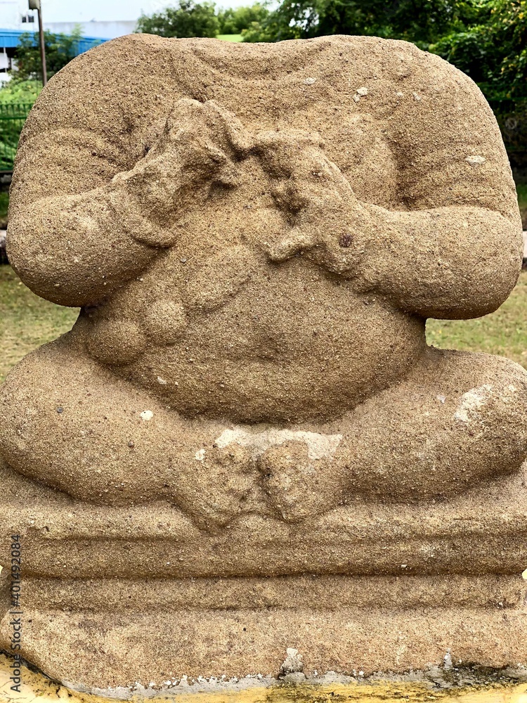 Hindu God deity statue. Ancient sandstone carved historical Hindu God ...