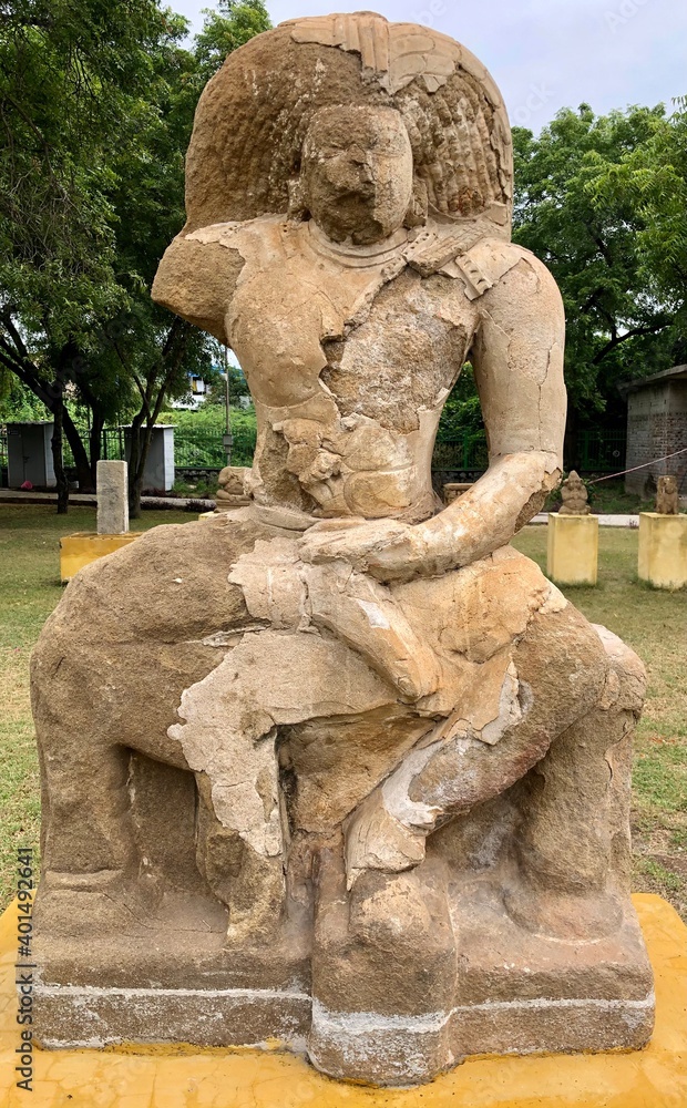 Hindu God deity statue. Ancient sandstone carved historical Hindu God ...