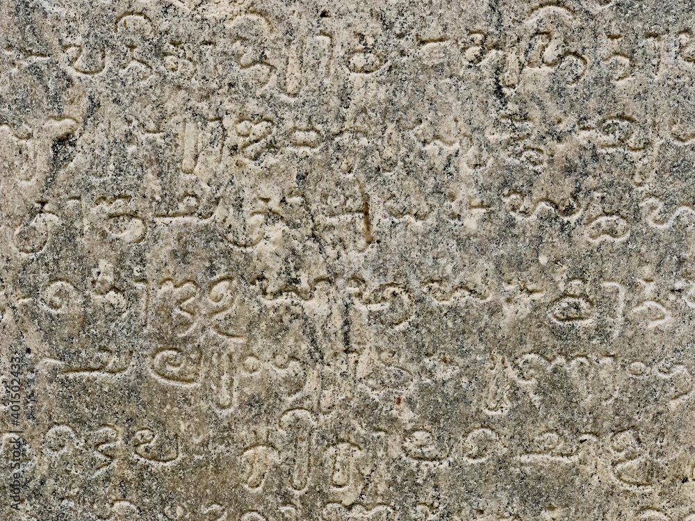 Inscriptions on the ancient temple stone walls. Ancient stone carving ...