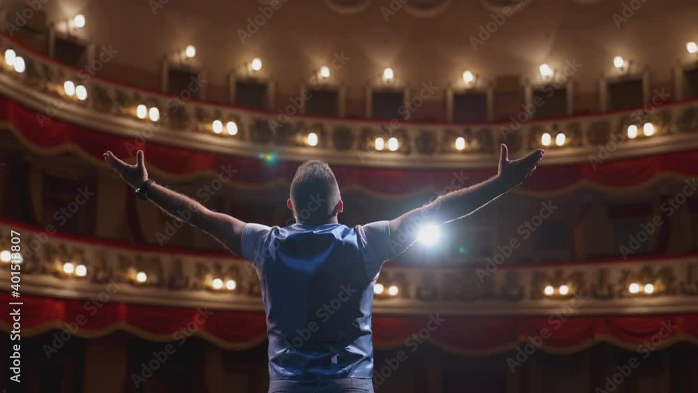 Man performing with gestures on stage. Unrecognizable actor standing on ...