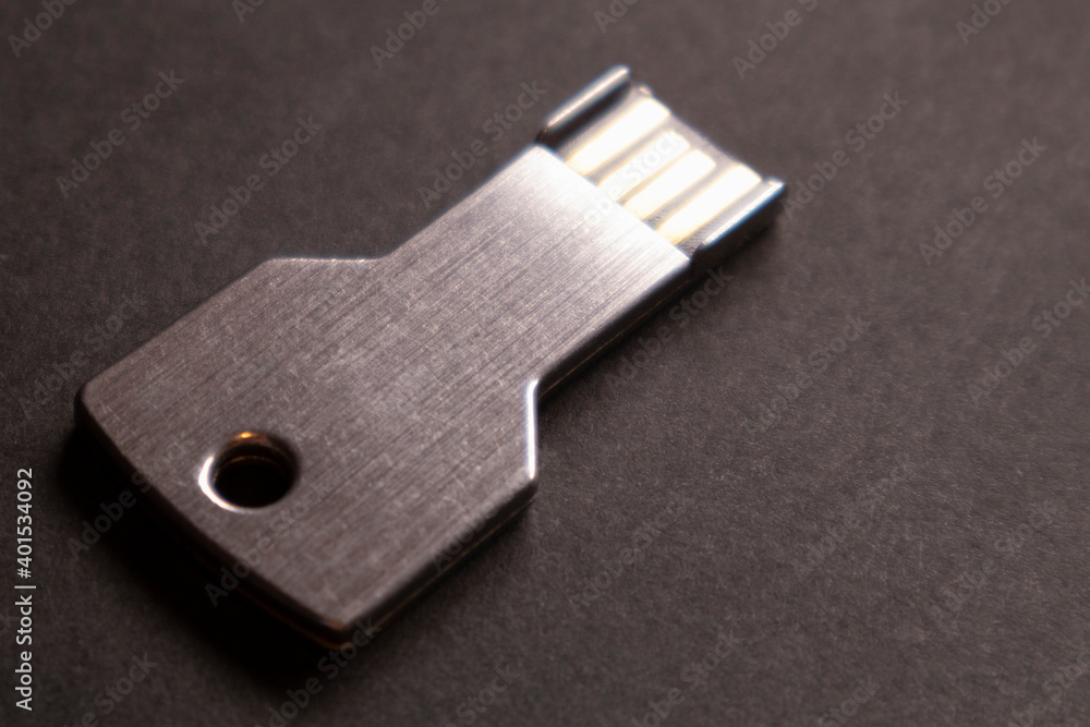 USB flash drive in the form of a key on a black background Stock Photo ...