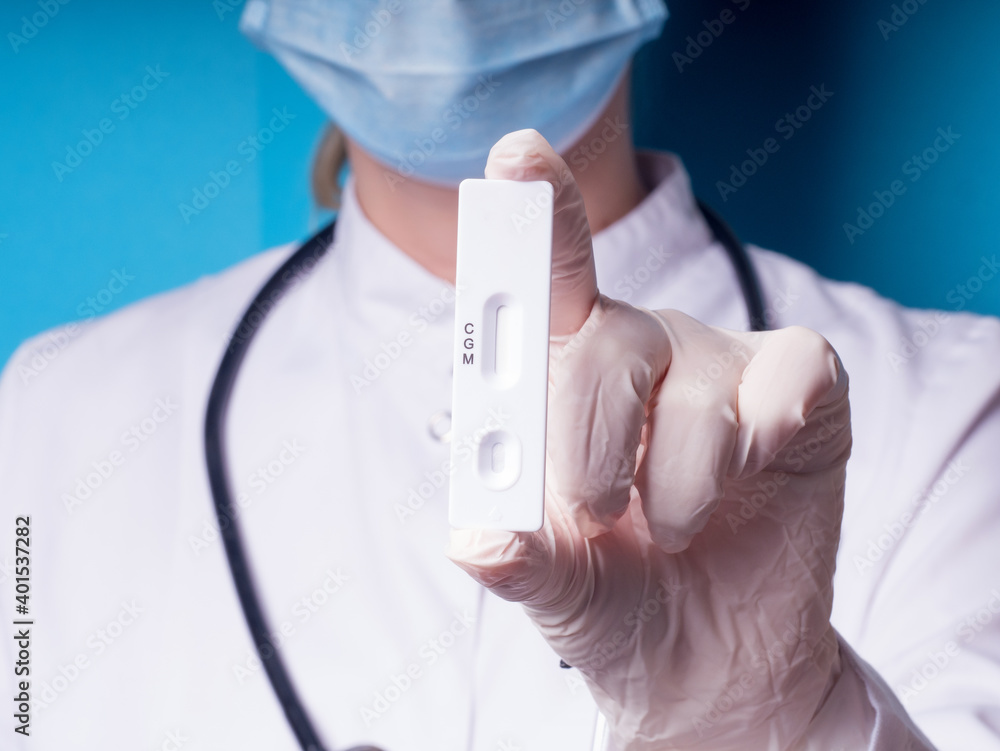 Doctor or medtech shows rapid laboratory COVID-19 test to detect IgM ...