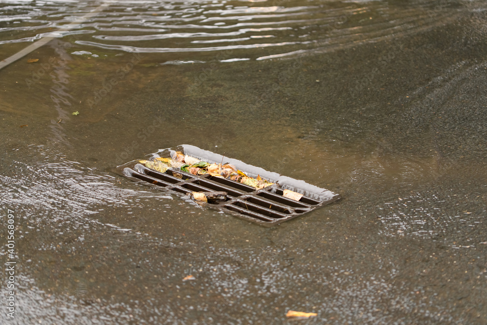 Rainwater drainage or storm grille closeup during a downpour Stock ...