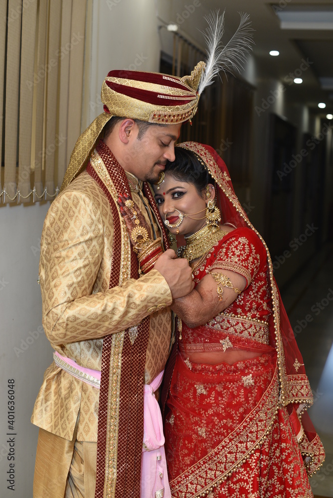 Young Indian Bride groom posing for photograph during their wedding ...