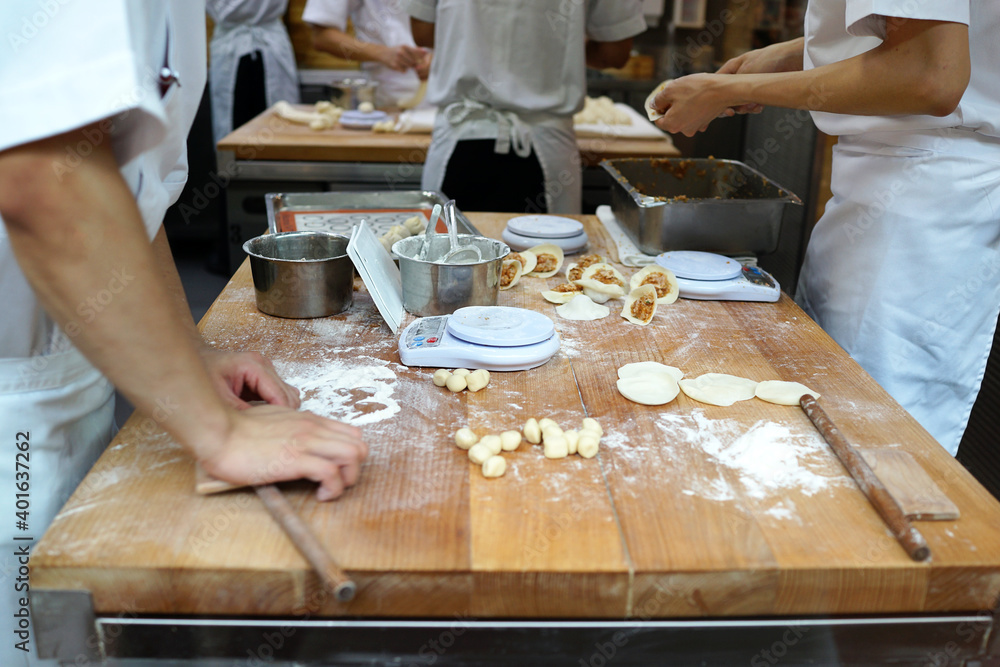 Taiwanese team of chefs cooking traditional food dumplings in the ...