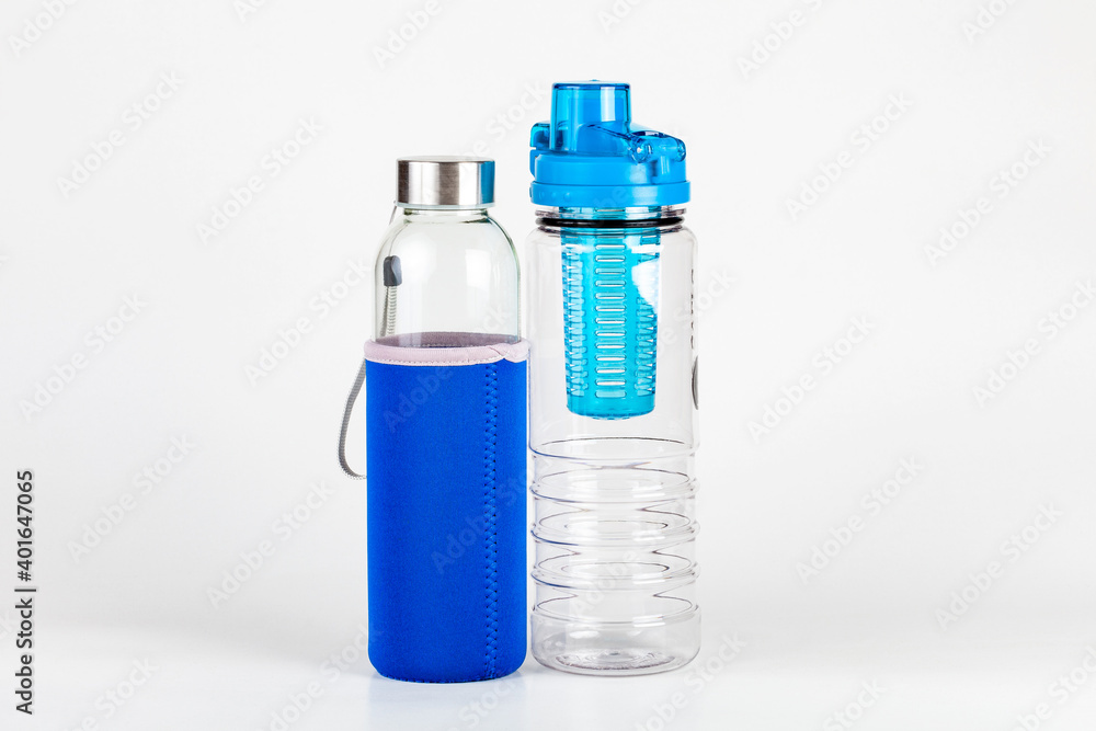 Two empty sport travel water bottles on white, one plastic with fruit ...