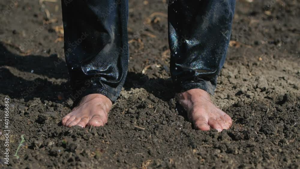 The Wanderer rejoices in the long-awaited rain in the desert. Male bare ...