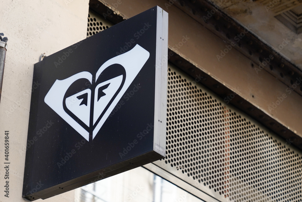 Quiksilver sign and brand logo front of shop on building facade ...