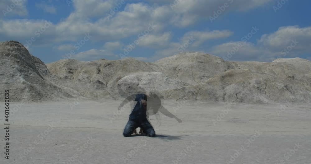 Lonely exhausted traveler goes mad in desert. Long-haired man in dirty ...