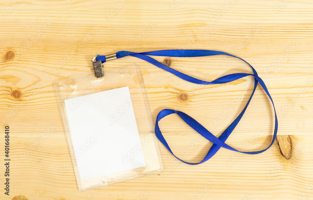 Blank badge mockup isolated on wood table. Plain empty name tag mock up ...