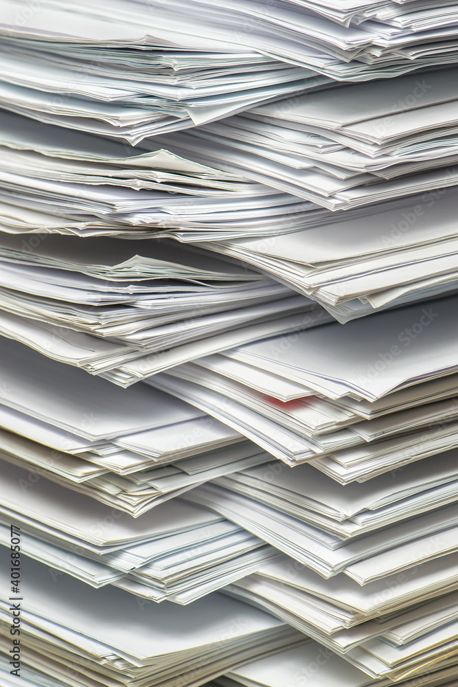 bundles bales of paper documents. stacks packs pile on the desk in the ...