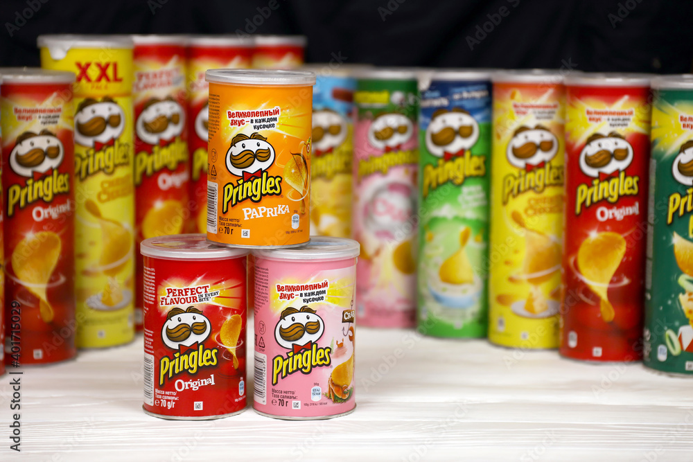 Pringles variety of flavors. Many cardboard tube cans with Pringles ...