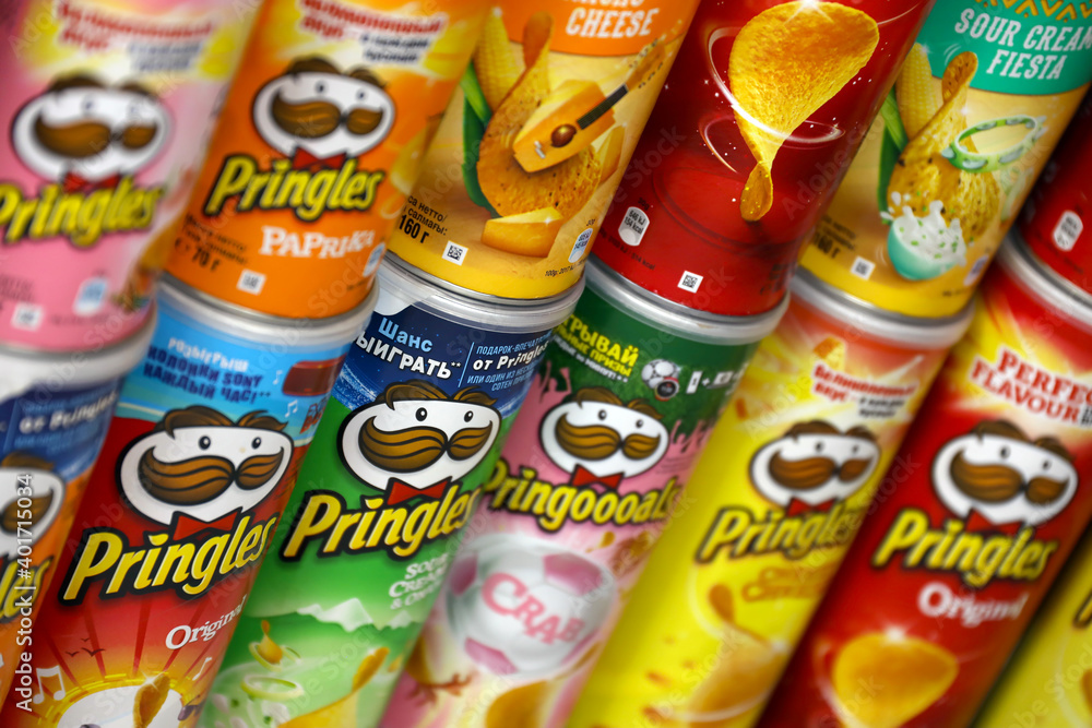 Pringles variety of flavors. Many cardboard tube cans with Pringles ...