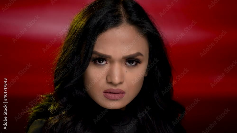 Annoyed Asian women give a very angry look as she turns toward and away ...