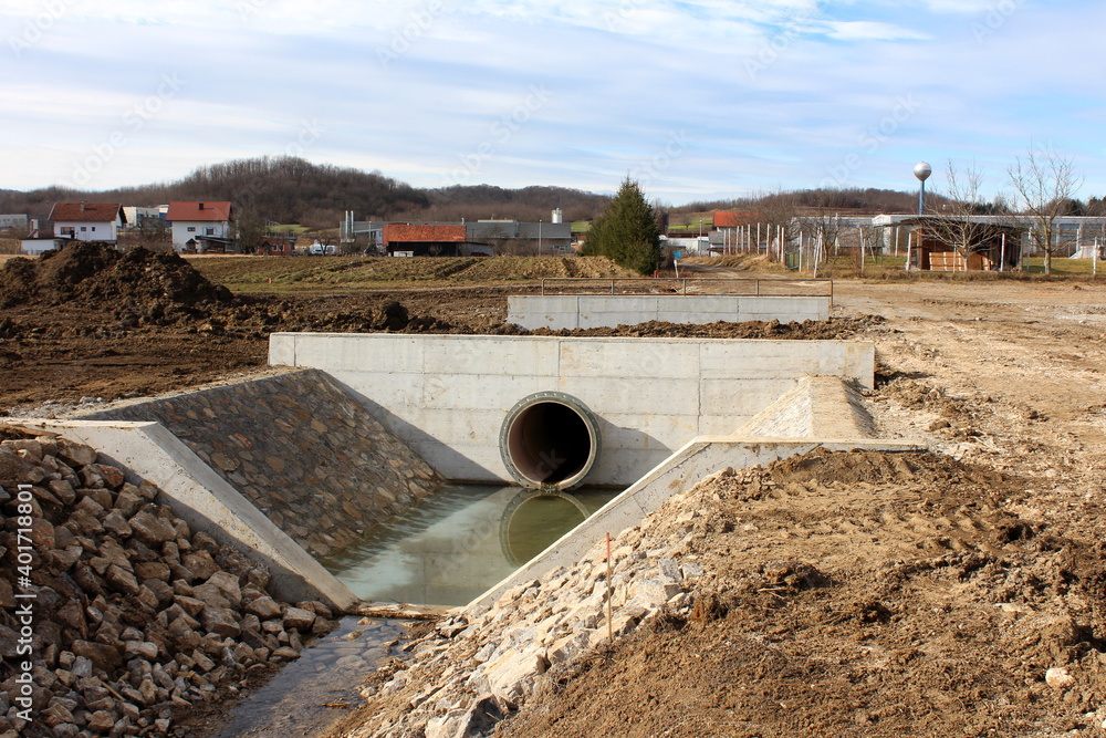 Open construction site for large diameter plastic and concrete pipes ...