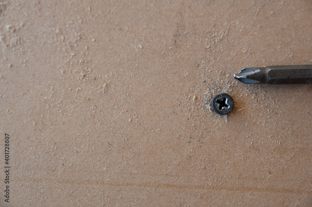 Stripped and damaged Philips screw on a wood surface Stock Photo ...
