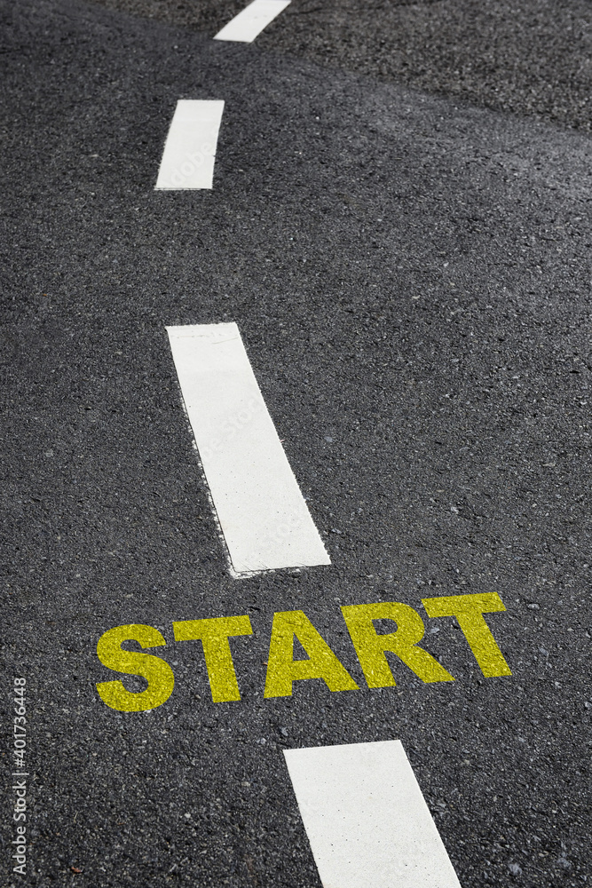 Start written on black asphalt road and white marking lines, Business ...