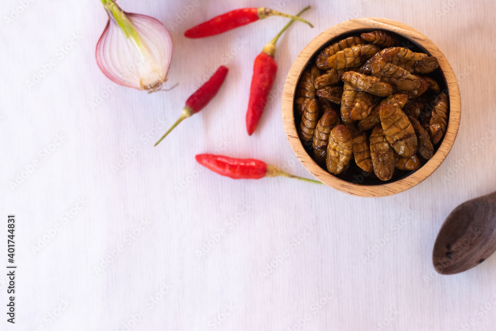 silkworm pupa in wooden bow as edible insects on white background, high ...
