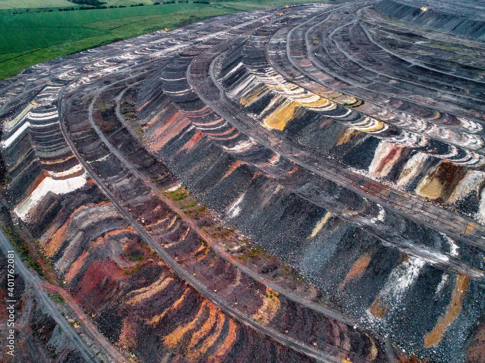 Huge mound of waste rocks. Industrial dump of a mining quarry ...