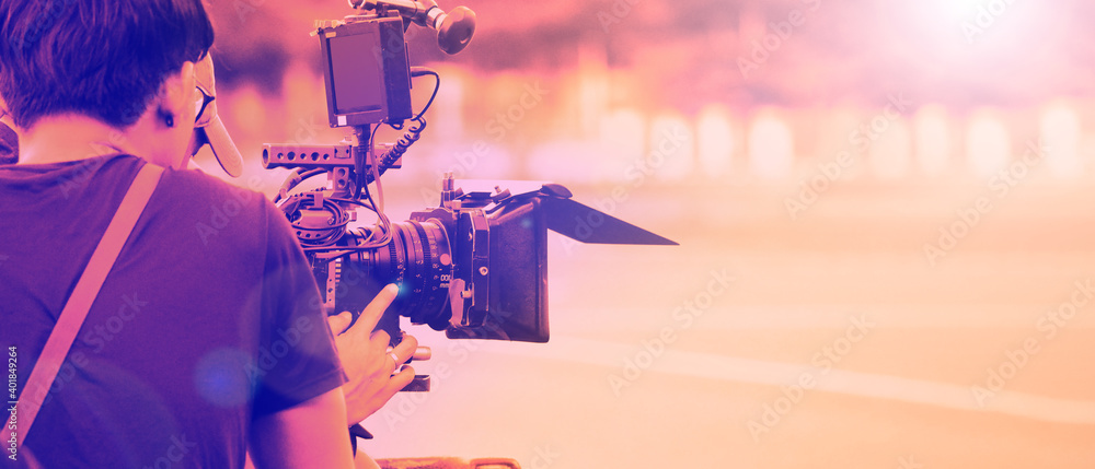 Film industry. Filming with professional camera. Videographer holding ...