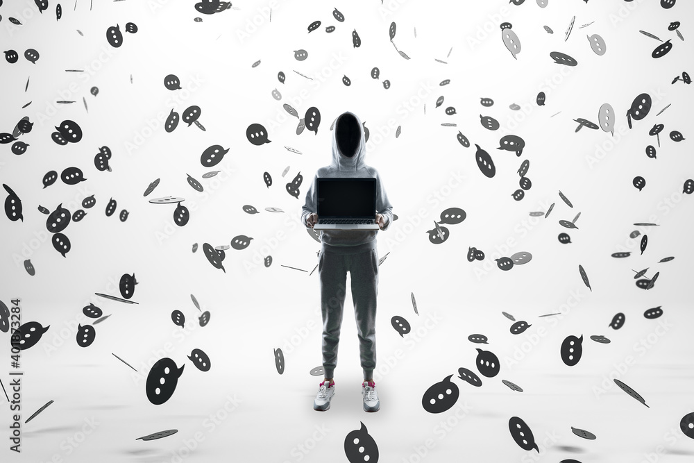Hacker holding laptop and flying black speech bubbles symbol on white ...