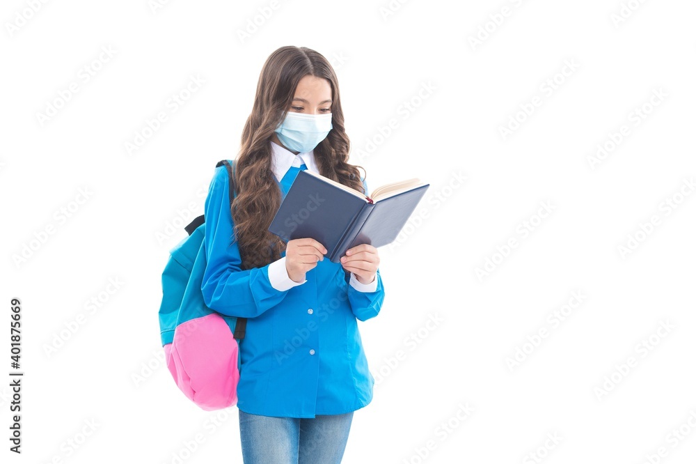 Little child read school book wearing face mask to prevent COVID-19 ...
