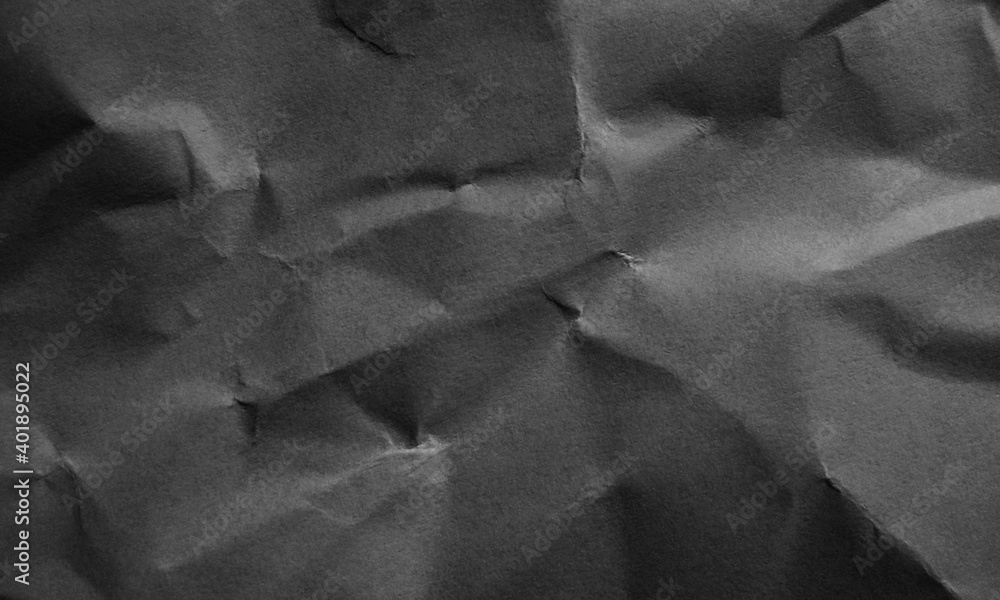 black colored crumpled paper texture background for design, decorative ...
