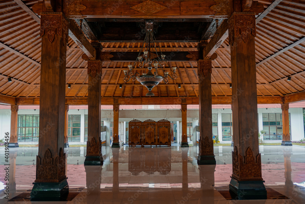 Interior of traditional house buildings in Java. It has 4 columns and ...